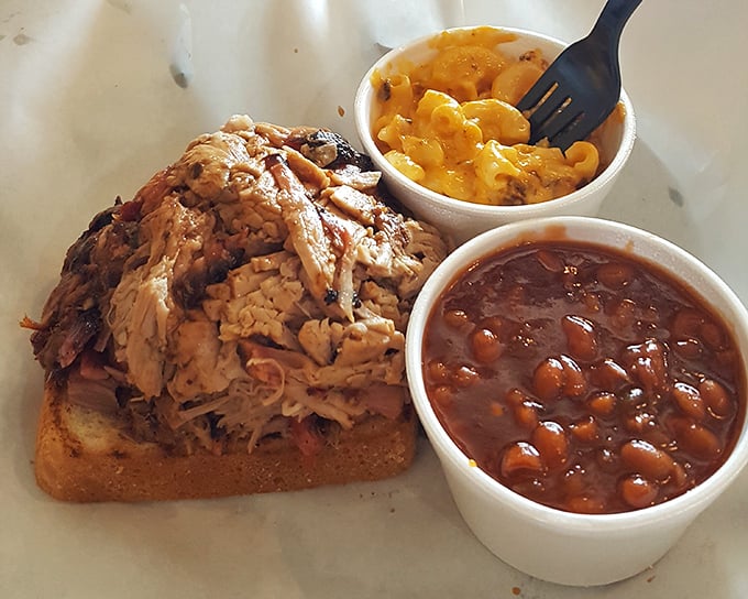 Pulled pork perfection on Texas toast with mac and beans. This isn't just lunch—it's what happiness would look like if it took physical form.