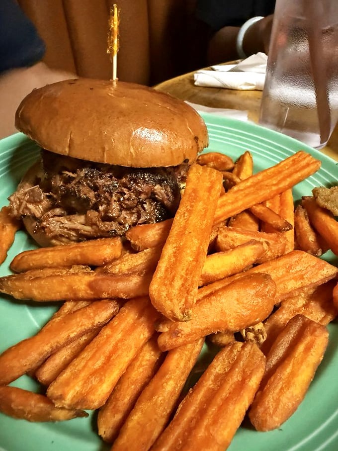 This pulled pork sandwich doesn't just satisfy hunger—it creates memories. Those golden fries could make a potato proud.