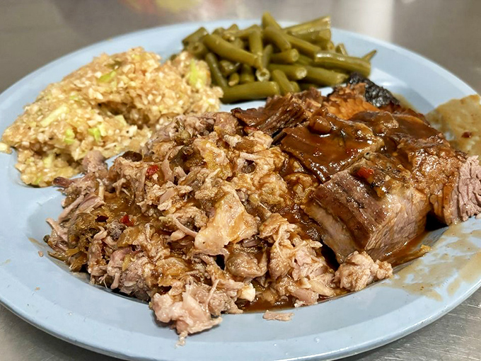 Barbecue perfection on a blue plate. That bark on the brisket is the result of patience, not a recipe you can rush.