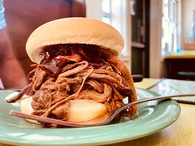 This isn't just a sandwich; it's a monument to patience. Tender pulled pork piled high, with sauce that complements rather than masks the meat's smoky glory.