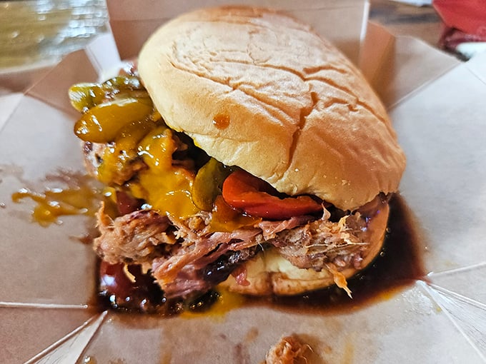 This isn't just a sandwich; it's a masterpiece of slow-smoked pork, tangy sauce, and pickles that might just make you weep with joy.