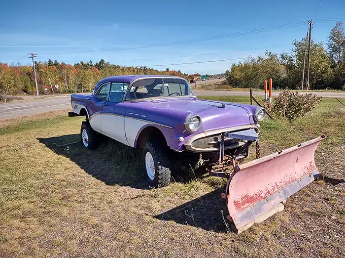 This purple beauty isn't just a car with a snowplow – it's winter transportation poetry, Upper Peninsula style.