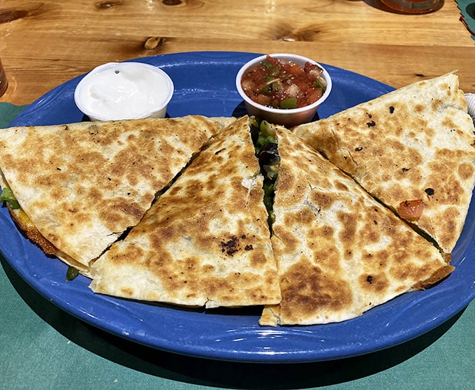 Golden-brown tortilla triangles hiding smoky treasures within—this quesadilla isn't just a meal, it's the reason GPS was invented.