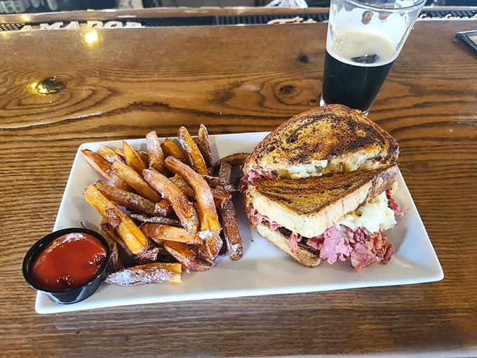 The star of the show in all its glory – a Reuben that doesn't need height to impress, just perfectly balanced corned beef, sauerkraut, and Swiss on grilled rye.