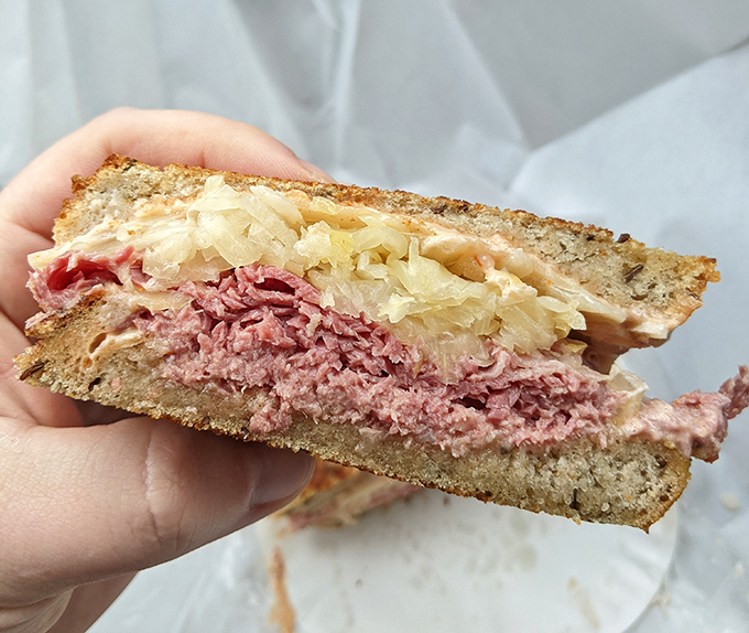 The holy grail of sandwiches – layers of pink corned beef, sauerkraut, and melted Swiss on rye. Napkins required, restraint impossible.