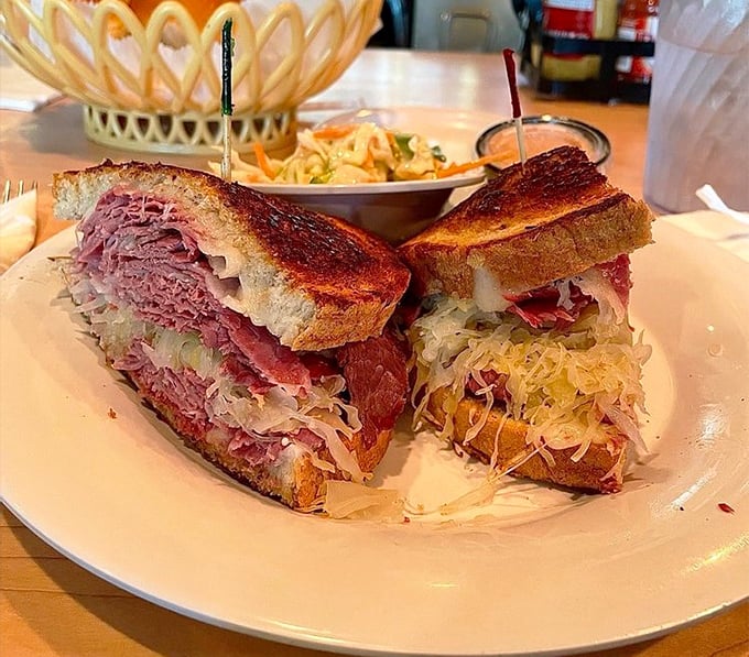 Behold the star of the show! This Reuben isn't just a sandwich—it's architecture, art, and pure joy stacked between perfectly grilled rye bread.