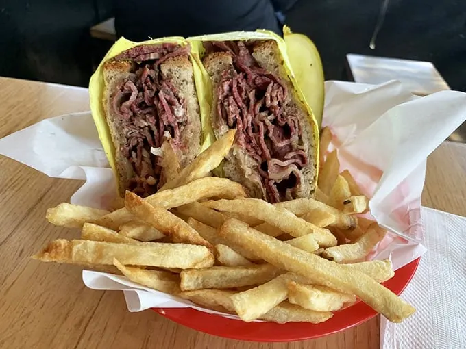 The Reuben doesn't just whisper "eat me"—it belts it out like Aretha Franklin, with pastrami piled higher than your weekend expectations.