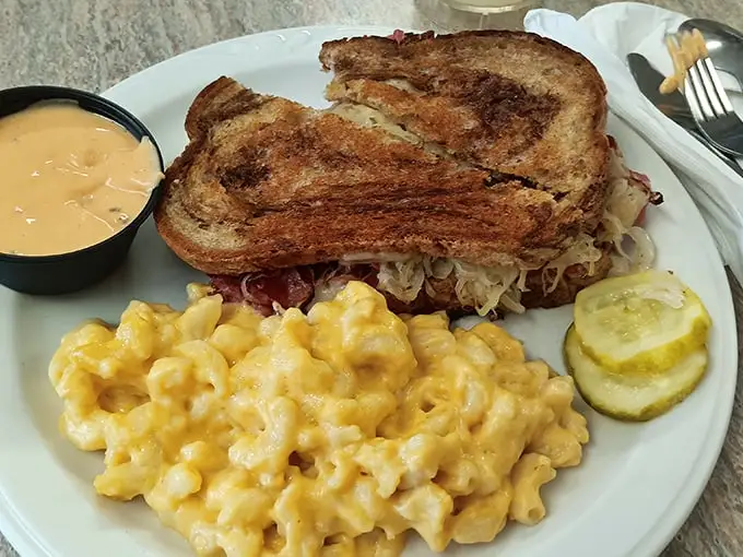 A proper Reuben doesn't need fancy presentation—just perfectly grilled bread, generous filling, and mac and cheese that would make your grandmother nod in approval.