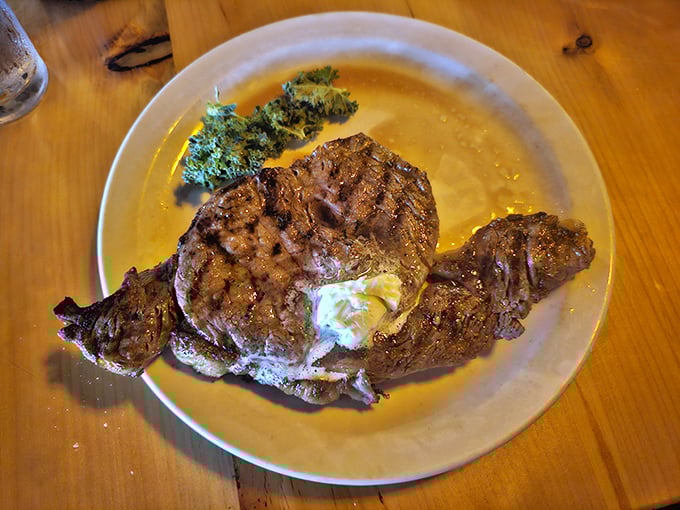 A perfectly cooked ribeye with a pat of melting butter on top—proof that sometimes the simplest pleasures are the most profound.