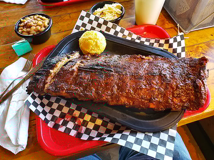 Not all heroes wear capes—some come on a checkered paper with cornbread and sides. These ribs don't just fall off the bone, they practically leap.
