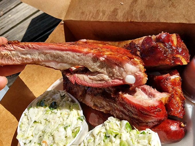 These ribs don't just fall off the bone – they practically leap into your mouth with that perfect pink smoke ring that barbecue dreams are made of.