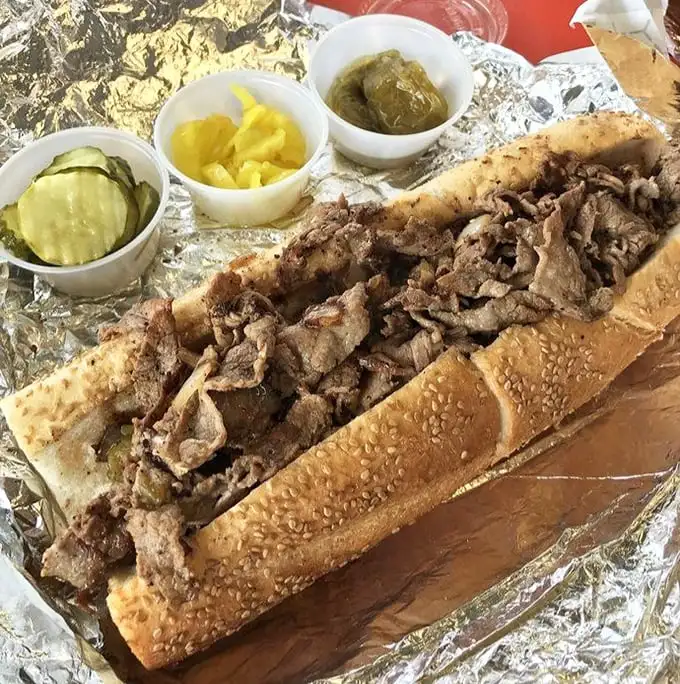The legendary roast pork sandwich in all its glory—juicy meat cradled in a seeded roll with the kind of confidence only true perfection can justify.
