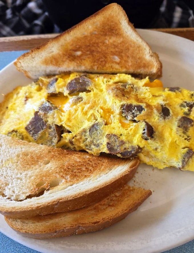 Behold the mushroom omelet masterpiece – fluffy eggs embracing earthy fungi like old friends reuniting.