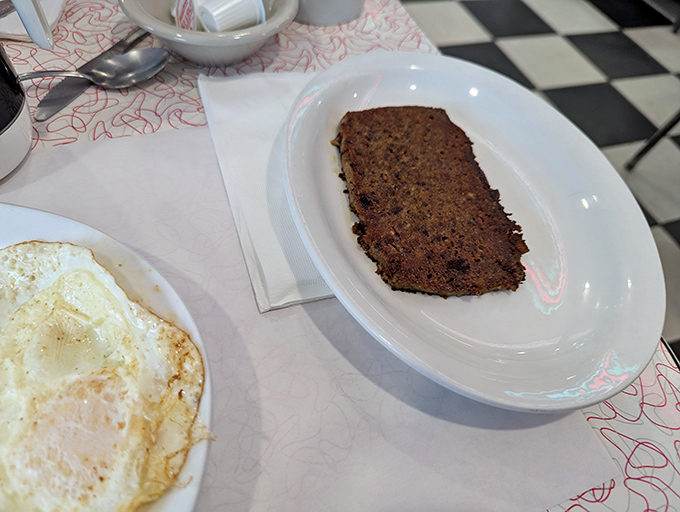 Behold Pennsylvania's misunderstood masterpiece—scrapple seared to golden perfection, a crispy exterior giving way to savory depths that transcend its humble origins.