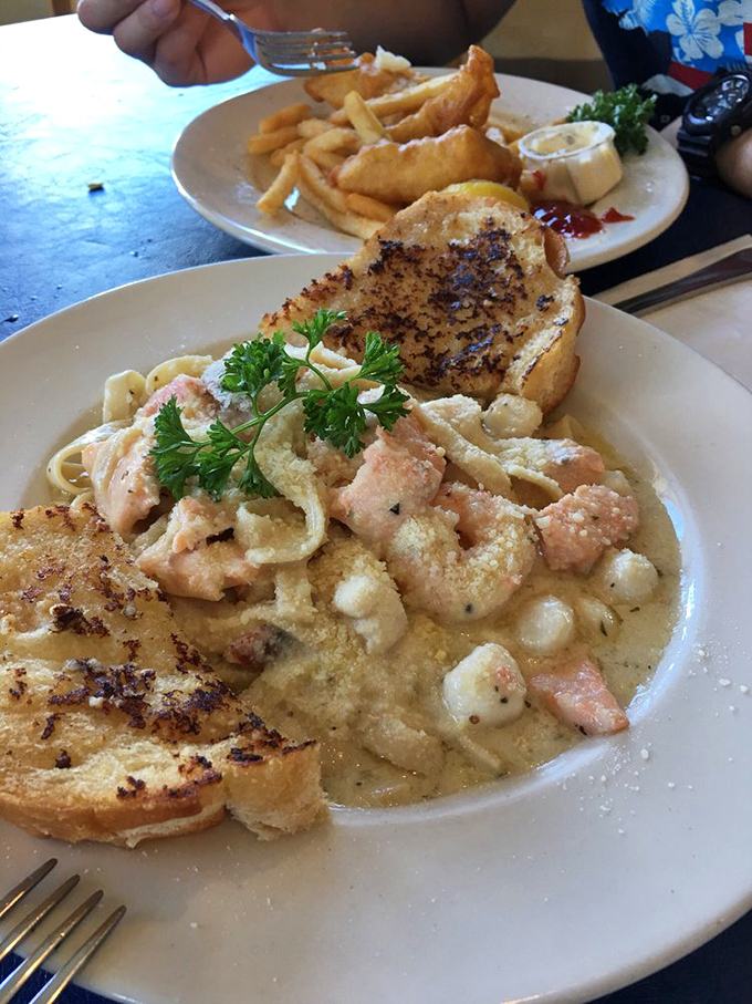 The star of the show: creamy seafood pasta that makes you close your eyes involuntarily. Salmon, scallops, and prawns swimming in a sauce that deserves its own fan club.