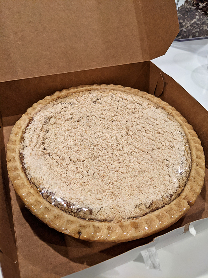 Behold the legendary shoo-fly pie in its natural habitat—a simple brown box that contains more happiness than most luxury purchases.