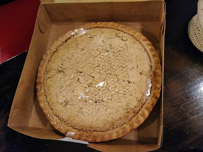 Shoofly pie in its natural habitat – a simple brown box that contains complex layers of molasses-sweet tradition that Pennsylvania Dutch grandmothers have perfected over generations.