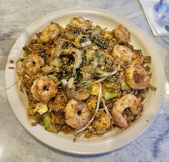 These plump shrimp nestled among vegetables and rice aren't just dinner—they're little ocean jewels waiting to make your taste buds dance.