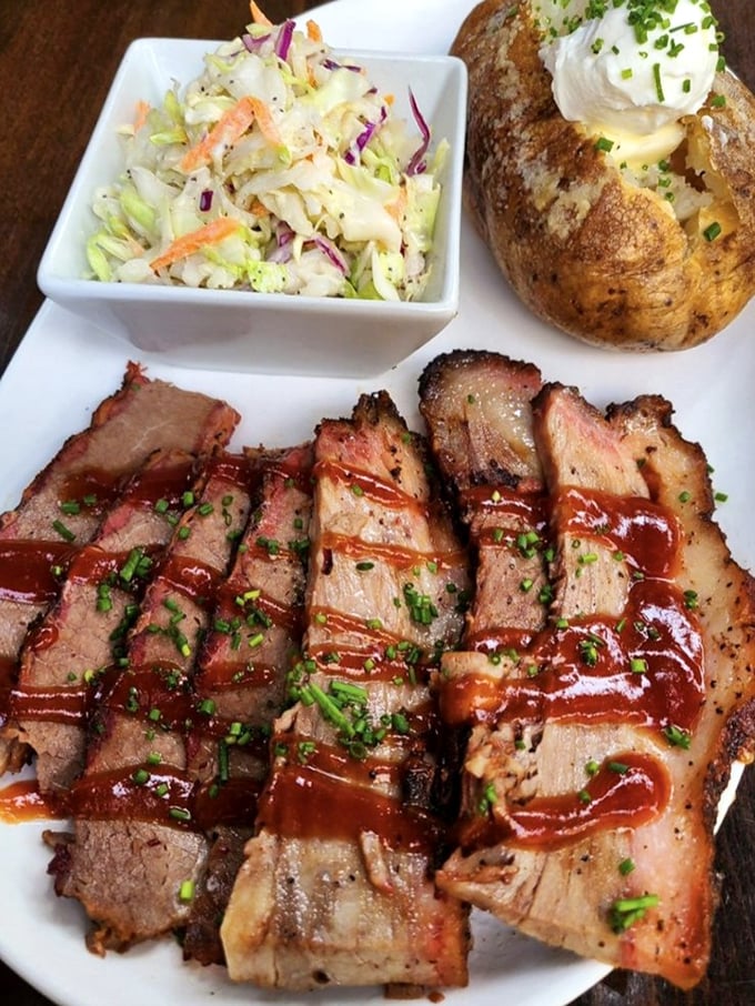Brisket that doesn't just fall apart – it surrenders with dignity. The pink smoke ring is nature's way of saying "you're welcome."