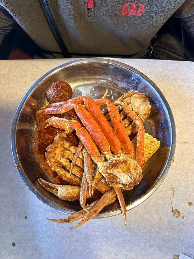 Snow crab legs arranged like nature's own puzzle—solving it with your hands and butter is the most delicious homework you'll ever do.