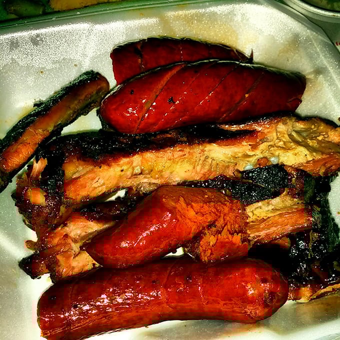 Behold the holy trinity of barbecue – ribs, brisket, and links that could make a vegetarian question everything.