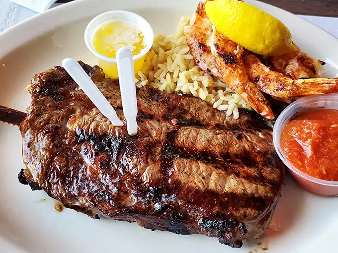 This steak doesn't just have grill marks; it has a personality. Paired with grilled shrimp and rice, it's the dinner equivalent of finding an extra $20 in your winter coat.