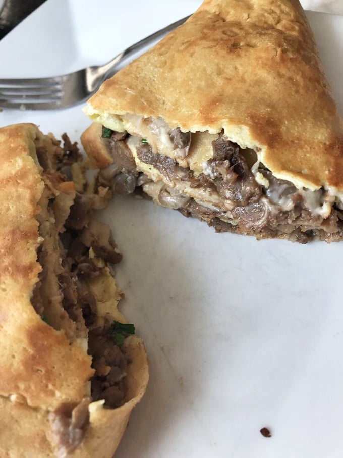Behold the Steak & Eggs crepe—where breakfast meets lunch in a delicate French wrapper that somehow manages to contain all that savory goodness.