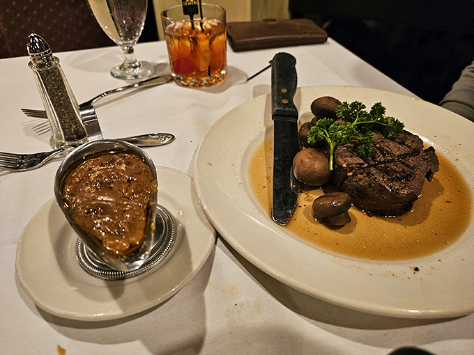 Behold the star of the show—a perfectly seared steak with mushrooms that have found their soulmate in butter. Lake Michigan views are just the bonus round.