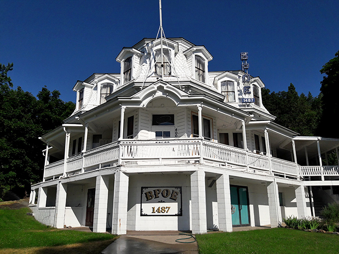 The magnificent Elks Lodge stands as a testament to bygone architectural grandeur—like a wedding cake designed by someone who really, really loved columns.