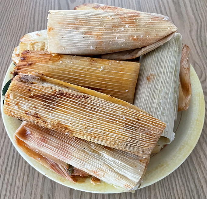 Corn husks cradling culinary magic. These tamales aren't just food—they're edible time capsules of tradition, each one a handcrafted masterpiece.