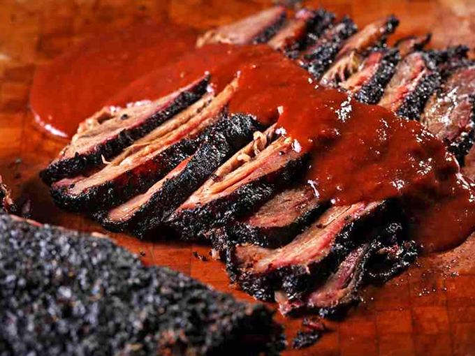 Brisket that doesn't just melt in your mouth—it starts a whole conversation. That smoke ring is nature's way of saying "you're welcome."
