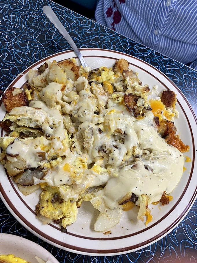 The Hobo Skillet doesn't mess around—eggs, potatoes, and cheese melding together in a symphony that would make any railroad traveler weep with joy. 