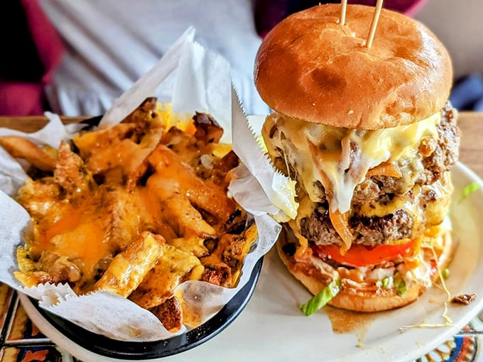 Behold the architectural marvel that is a Thurman burger—where cheese cascades like lava and the bun heroically attempts to contain the meaty madness within.