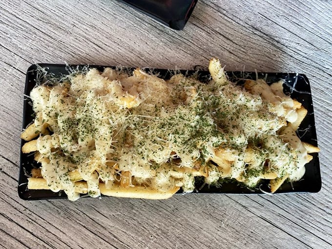 These aren't your average truffle fries—they're a masterclass in indulgence, where every herb-dusted bite demands your full attention.
