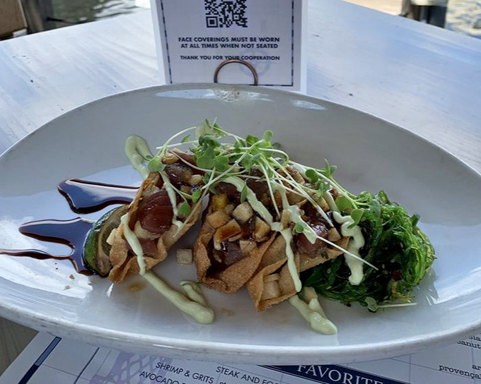 These aren't just tuna tacos—they're edible architecture. Crispy shells cradle ruby-red fish while microgreens stand guard like tiny, delicious sentinels.