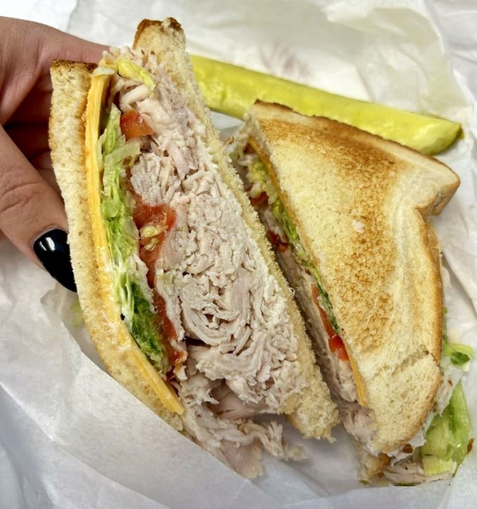 A turkey sandwich that makes all your sad desk lunches look like tragic mistakes. That pickle spear isn't just a garnish—it's essential structural support.