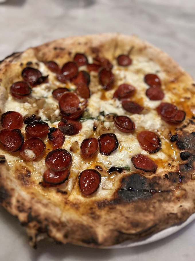 This Diavola pizza isn't just food – it's a religious experience. Those crispy-edged pepperoni discs are little flavor bombs of pure joy.