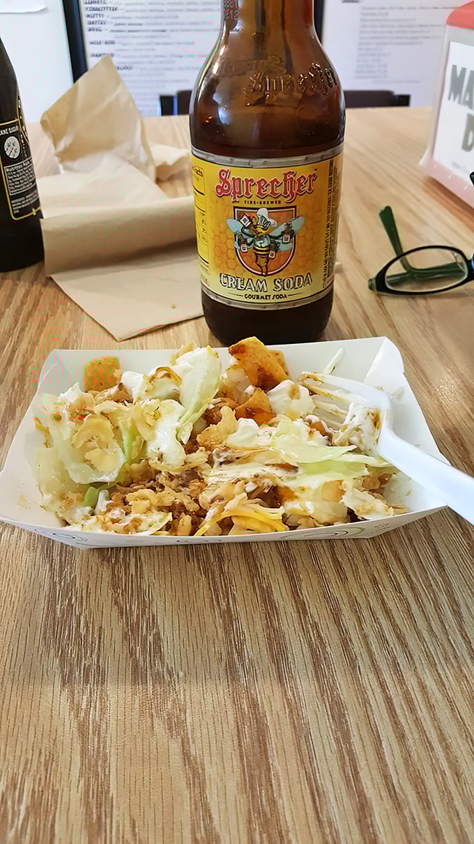 This isn't your average walking taco—it's a portable flavor festival paired with craft soda that makes standard ballpark fare look like it's not even trying.