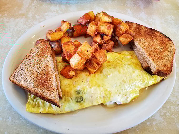 This Western omelet doesn't just arrive at your table; it makes an entrance, flanked by golden home fries that could make a potato farmer weep with pride.