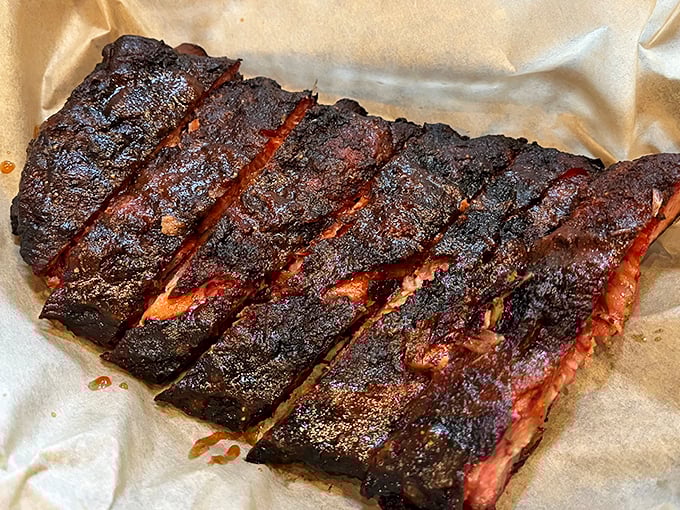 These ribs don't just fall off the bone—they practically leap into your mouth, sporting that perfect bark that BBQ dreams are made of.