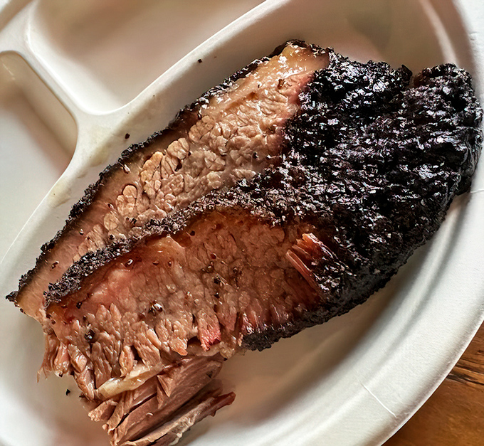 Behold the brisket – that bark, that smoke ring, that tenderness! This isn't just meat; it's a religious experience on a plate.