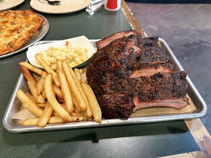 Behold the beef ribs in their bark-crusted glory! These aren't just ribs—they're prehistoric monuments to the art of smoking meat.