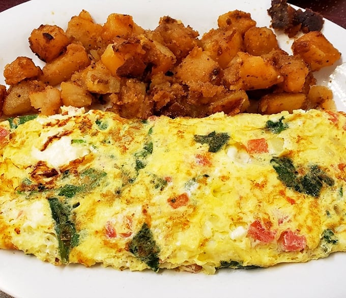 This veggie-packed omelet with perfectly crisped home fries isn't just breakfast—it's edible therapy that makes Monday mornings bearable again.