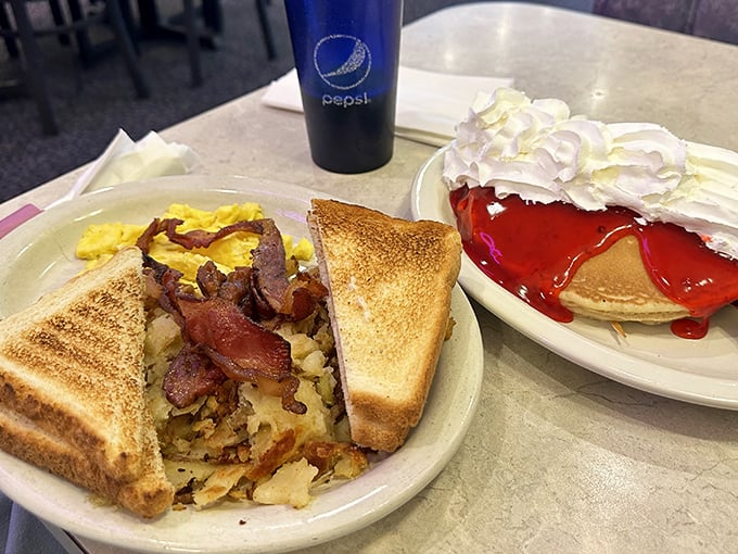 Breakfast perfection doesn't need filters. Golden home fries, crispy bacon, perfectly toasted bread, and strawberry pancakes that make chain restaurants weep with inadequacy.