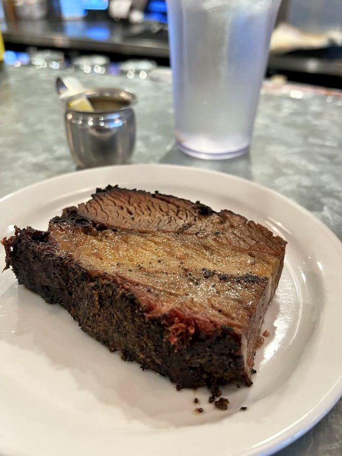 Behold the star of the show – brisket with a smoke ring that would make a pitmaster weep. This isn't breakfast meat; it's breakfast royalty.