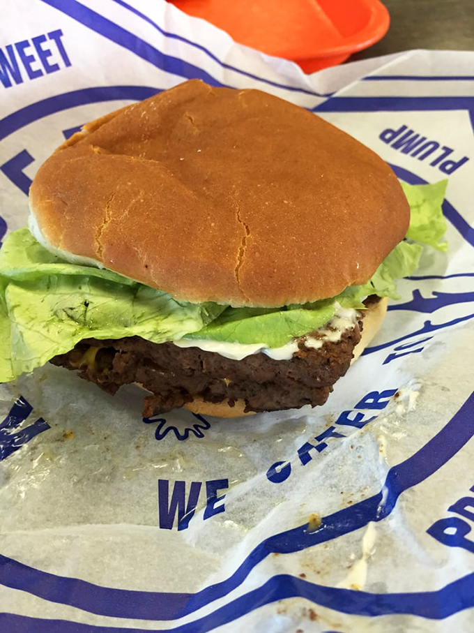The classic Kewpee burger—where the patty hangs slightly over the bun like a meat waterfall of deliciousness.