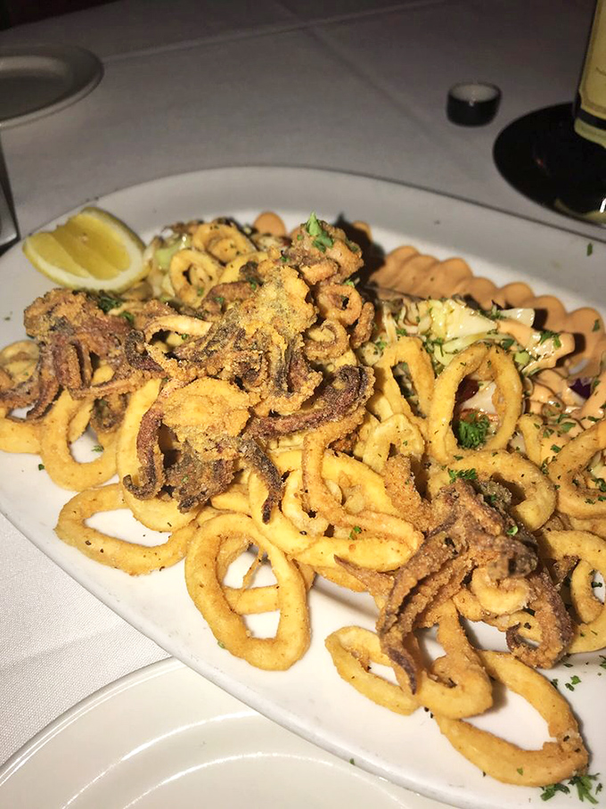 Golden-fried calamari that's actually tender—not those rubber bands masquerading as seafood that haunt lesser establishments. The star of our show!