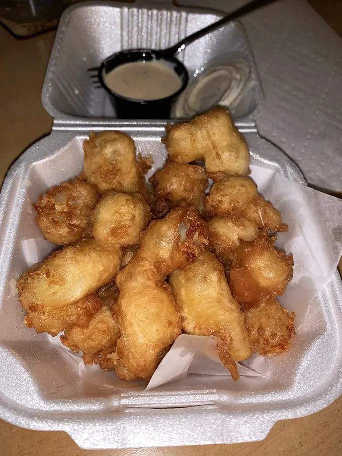 These golden-battered cheese curds aren't just appetizers—they're little nuggets of joy that make you question why you'd ever share them.