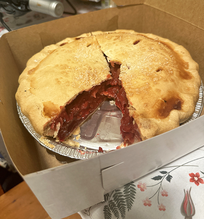 This cherry pie isn't just dessert—it's Door County's soul in a tin, with that perfect balance of flaky crust and ruby-red filling that makes grown adults weep.