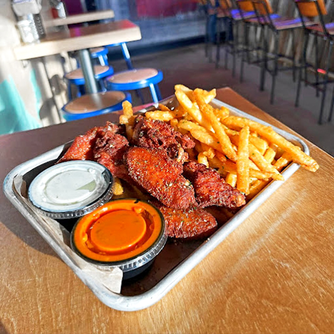 These aren't your average wings – crispy, seasoned to perfection, and served with dipping sauces that'll have you contemplating drinking them straight.